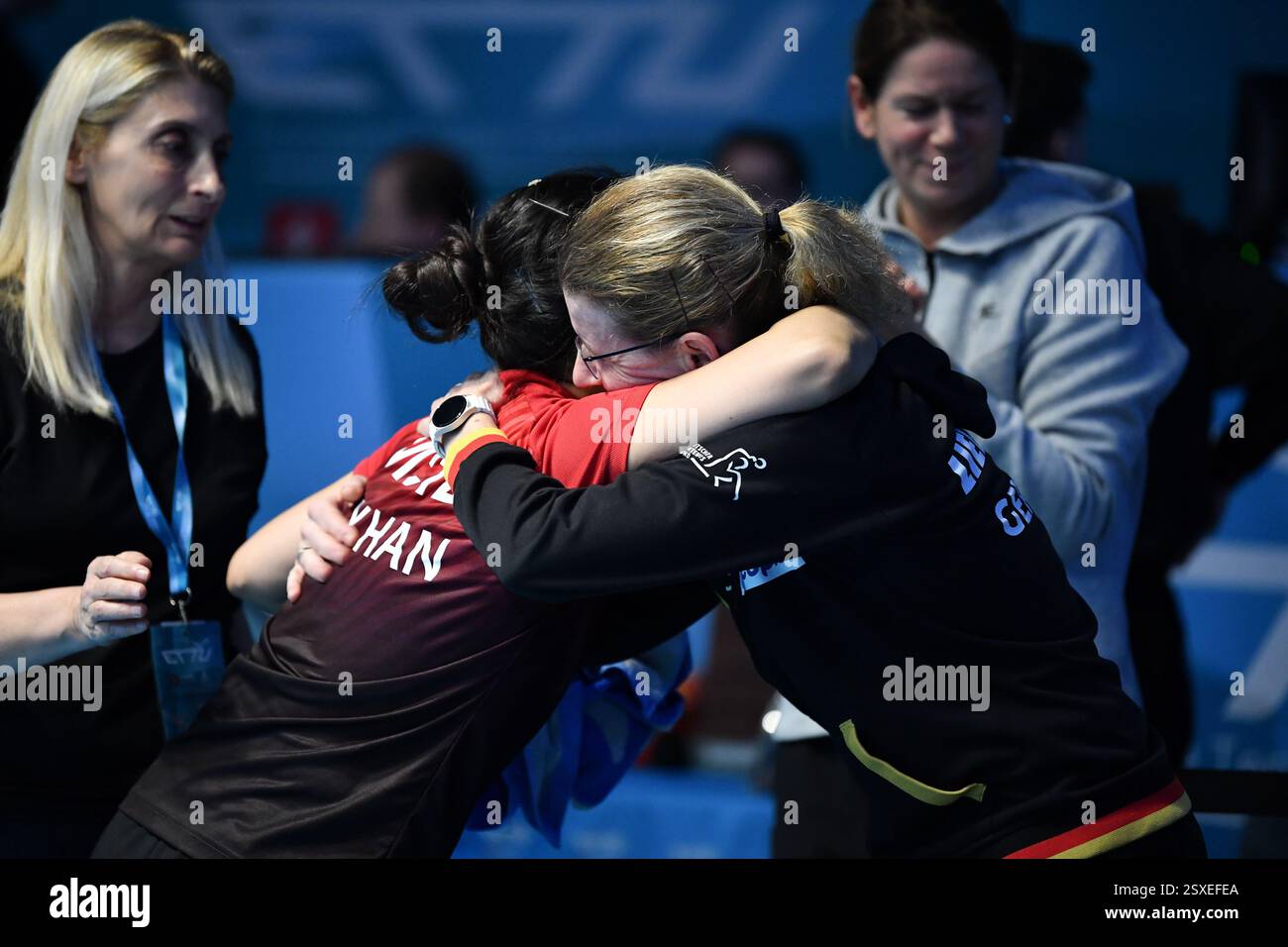 Montreux, Switzerland. 23rd Feb, 2025. Han Ying (L) of Germany hugs her ...
