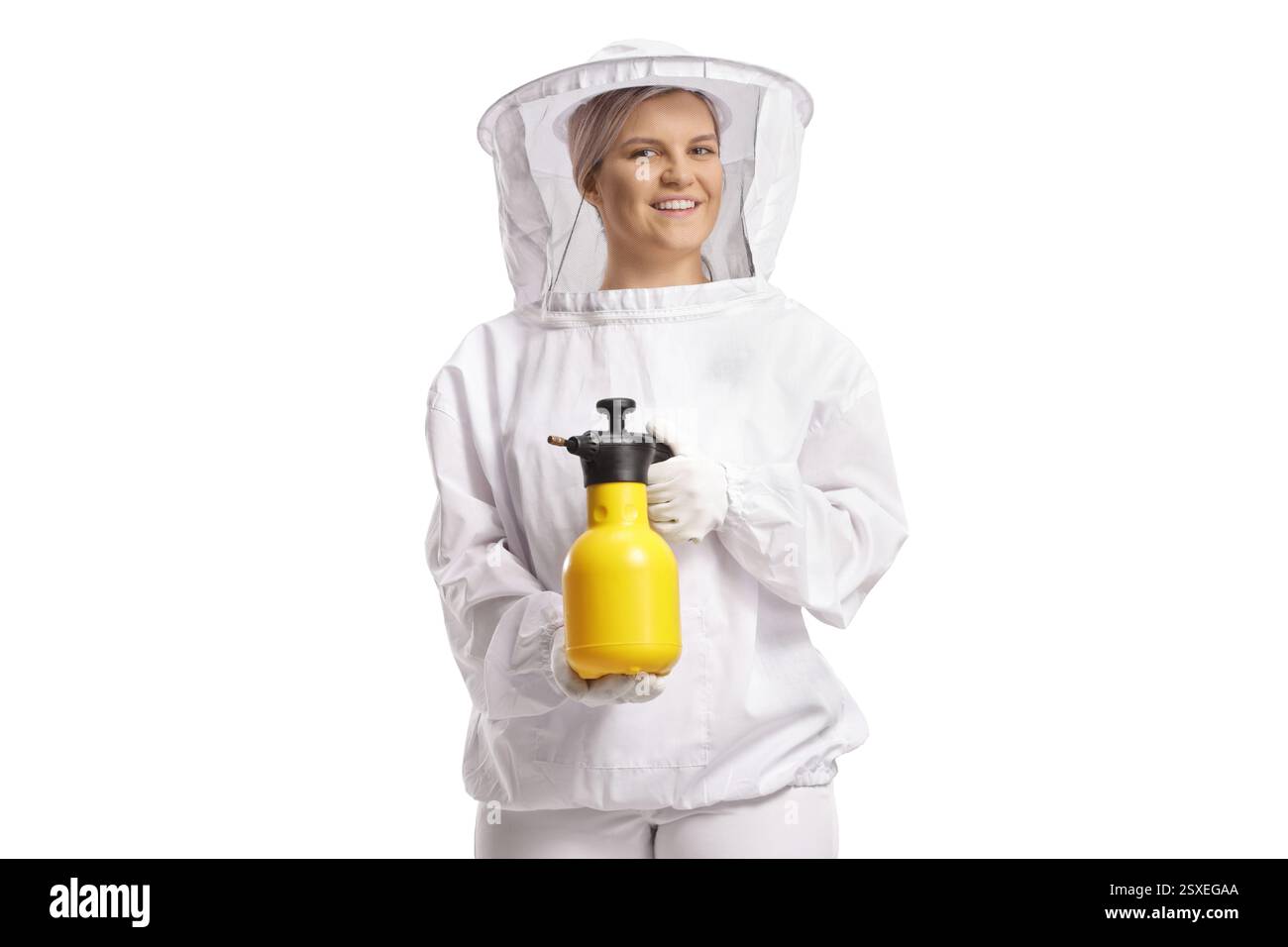 Female bee keeper in a uniform holding a sprayer isolated on white ...
