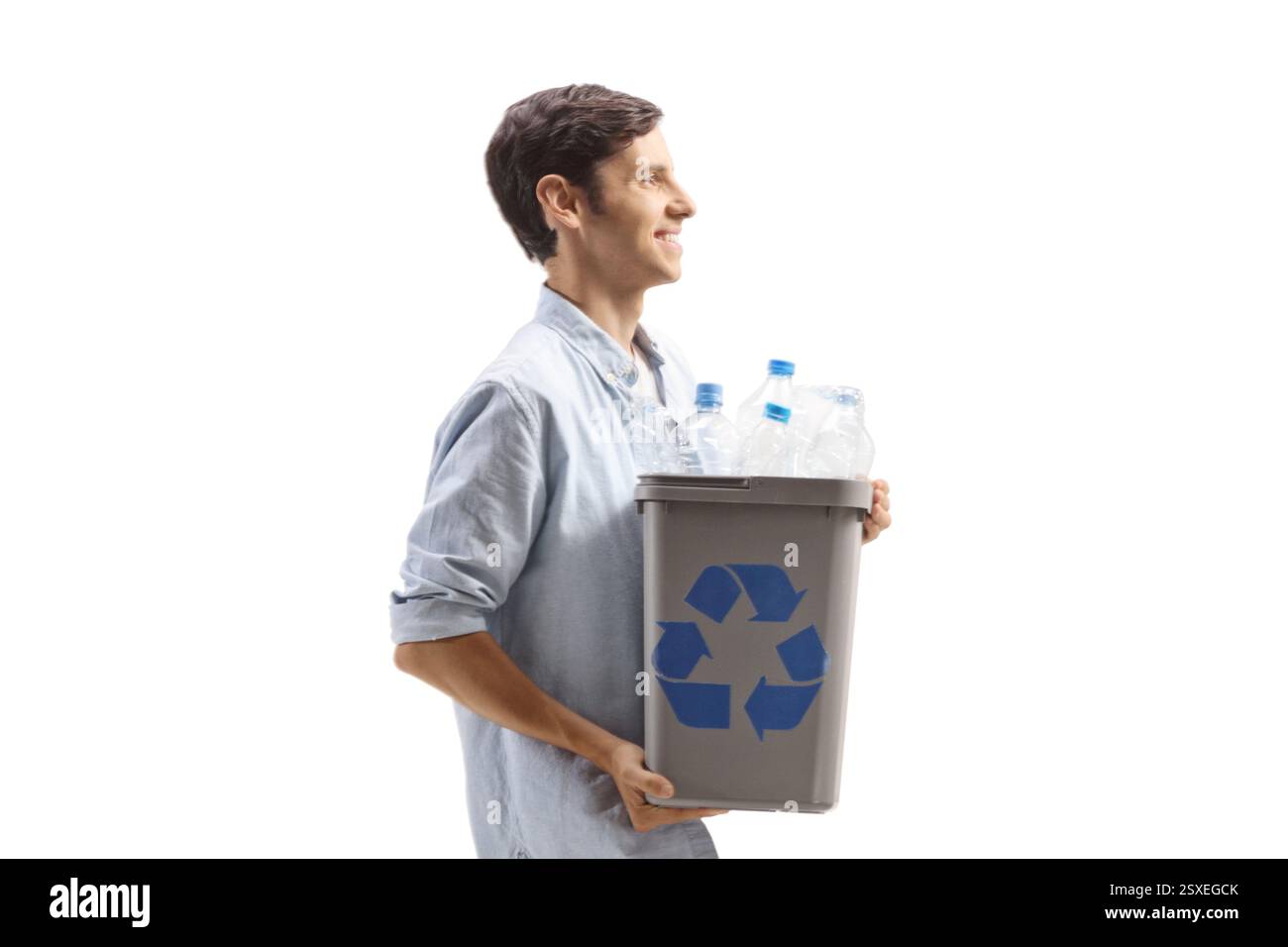 Young man carrying a recycling bin with plastic bottles isolated on ...