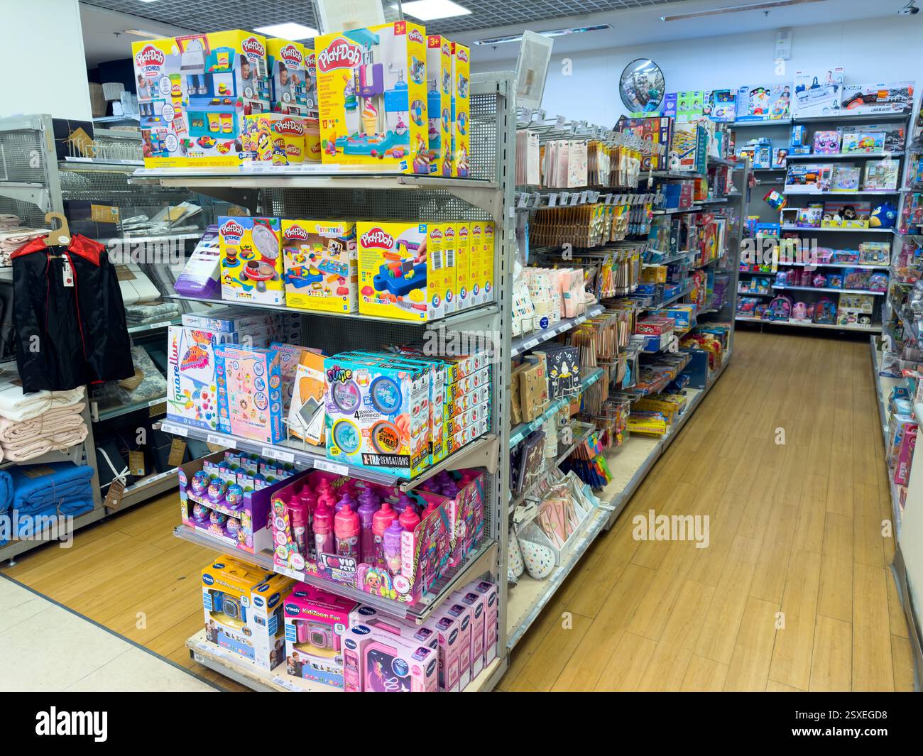 Colorful aisles of creativity in a bustling toy store during midday ...