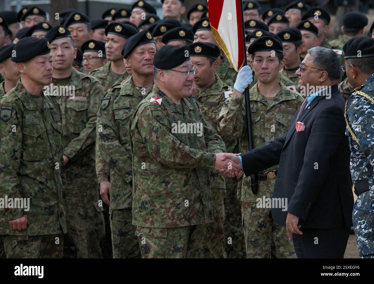 Ambassador of India to Japan Sibi George shakes hands with members of ...
