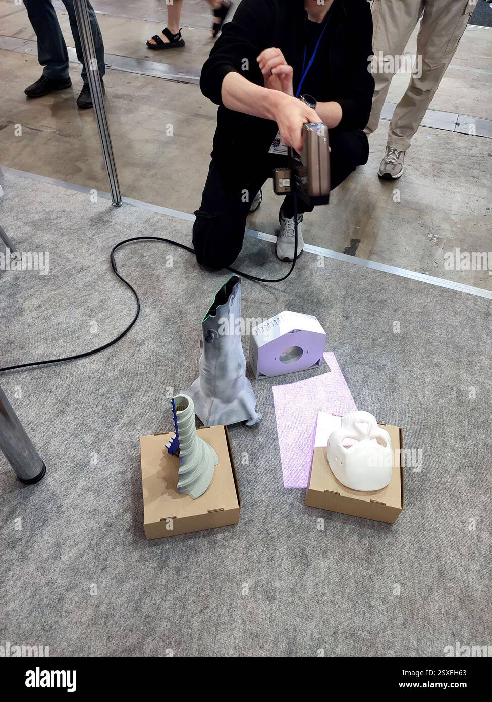 3D scanning. Working portable 3D scanner. Man scanning an object with a ...