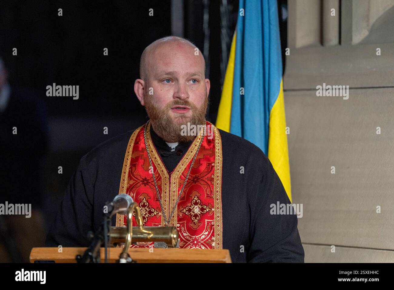 Reverend Father Vasyl Kren during a service to mark the third ...