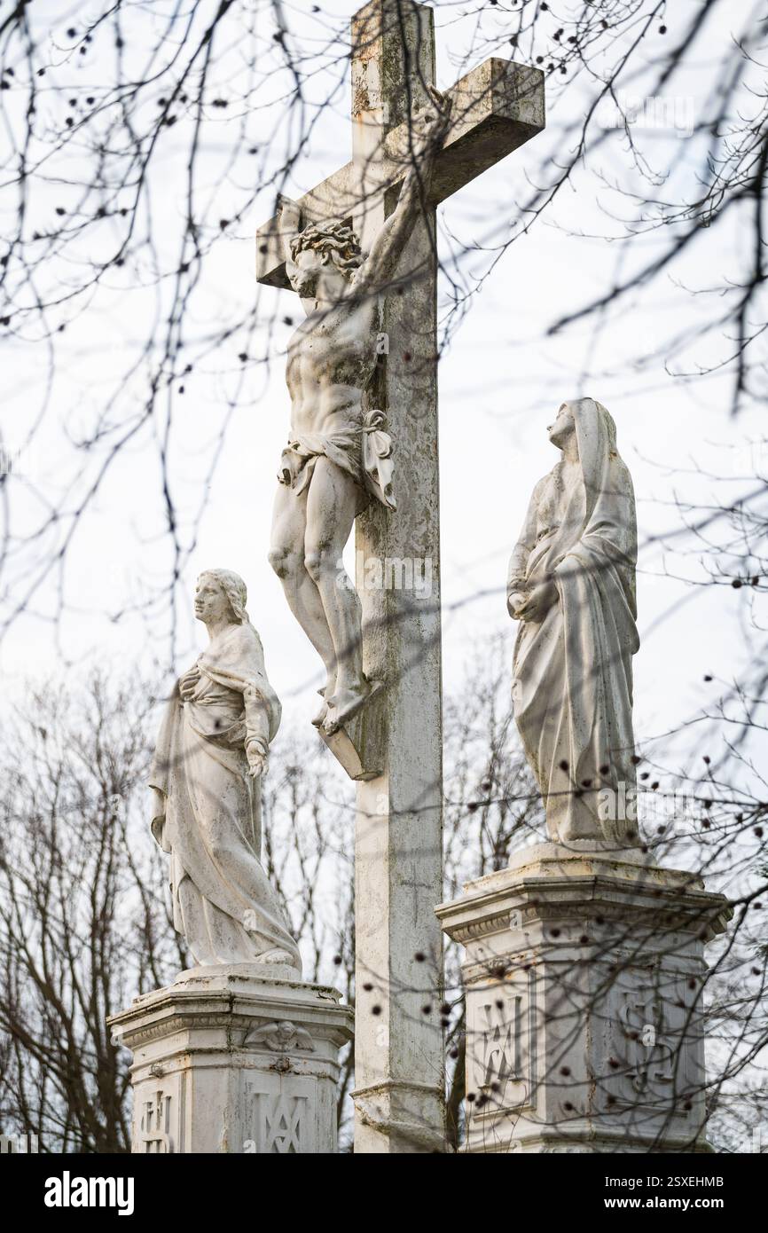 Statue of Jesus at the cross of Golgotha with Mary and Mary Magdalene ...
