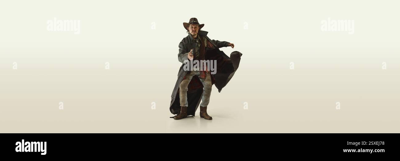 Man, cowboy in long leather coat dynamically drawing gun, coat flowing ...