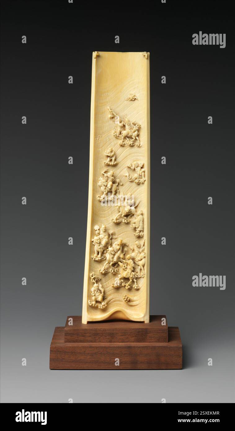 This 18th-century Chinese wrist rest features a seascape design along ...