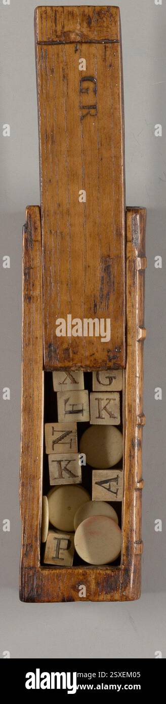 This 1810 alphabet game, carved from solid ash, is housed in a book ...