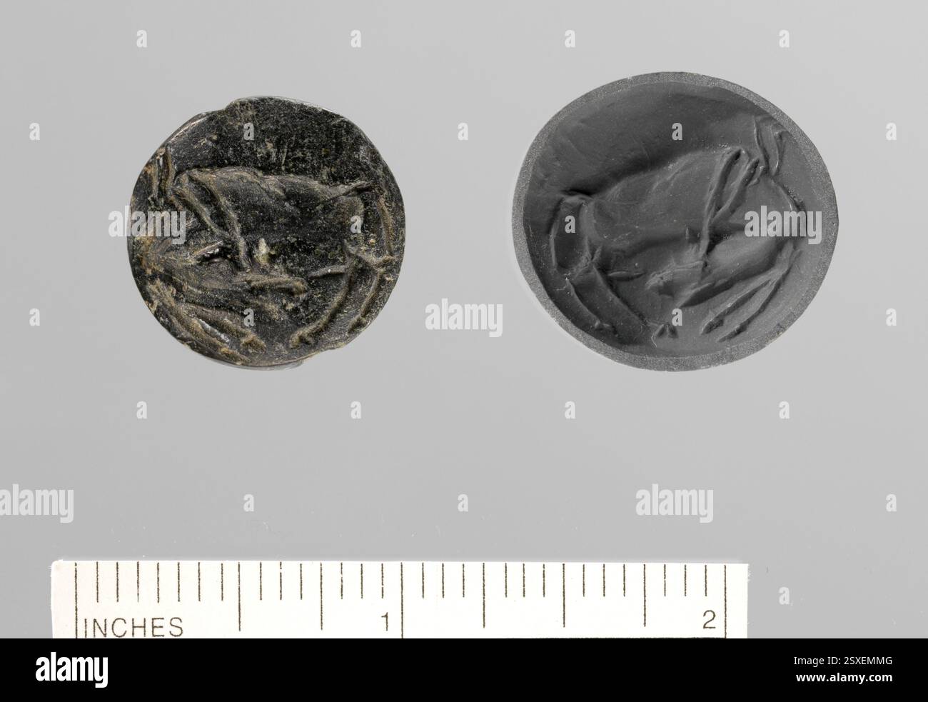 This Minoan Marble Lentoid gem (ca. 1400–1200 BCE) features a bull ...