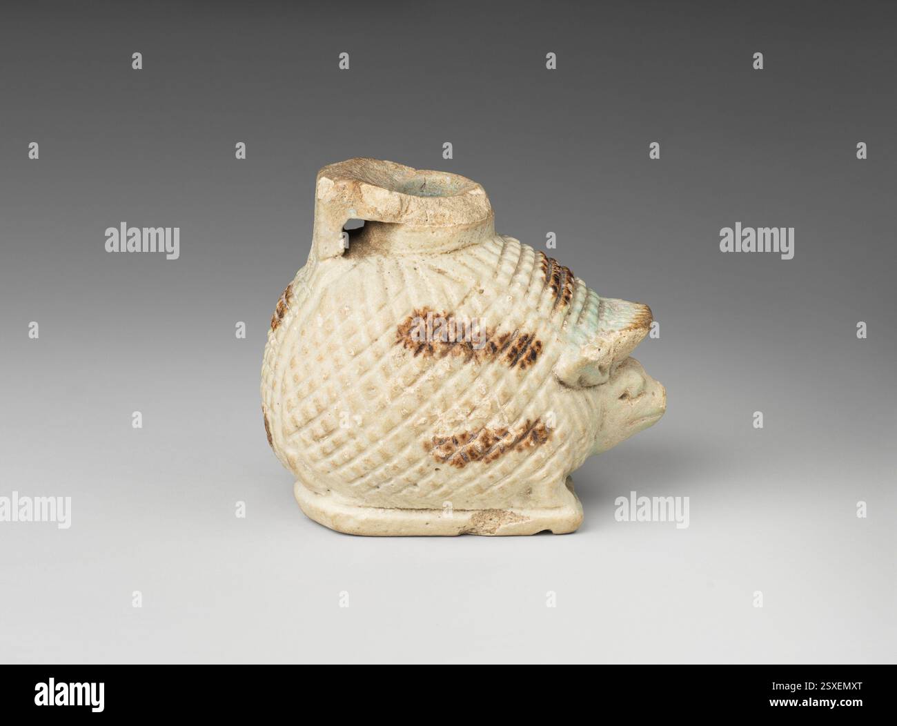 A 6th-century BC Egyptian aryballos, or perfume jar, shaped like a ...