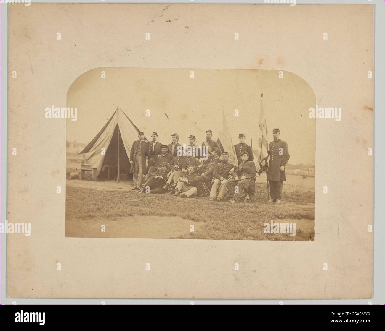 This 1861-62 albumen silver print depicts soldiers and officers, likely ...