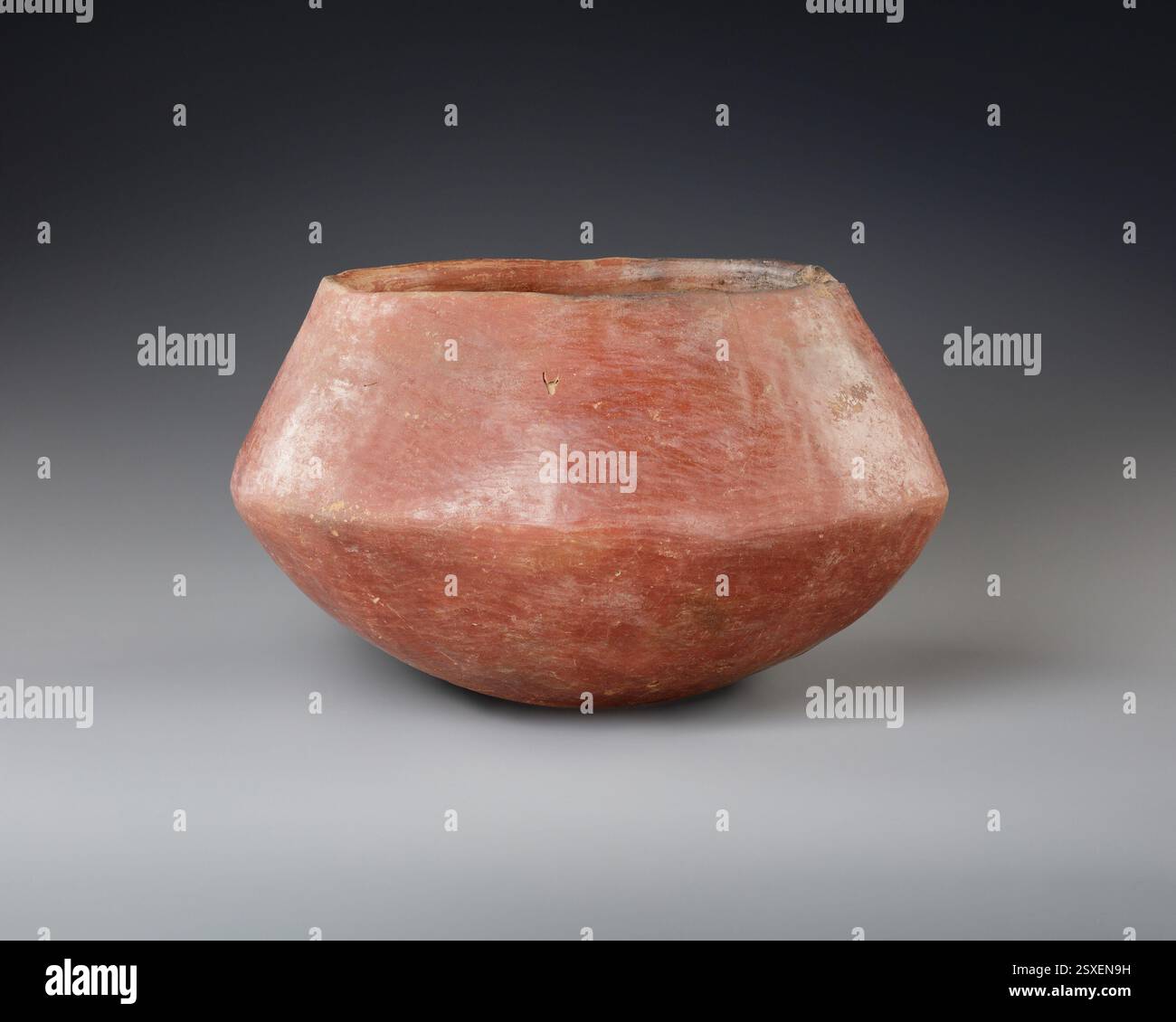 A red polished ware bowl dating to the Predynastic period of Egypt ...