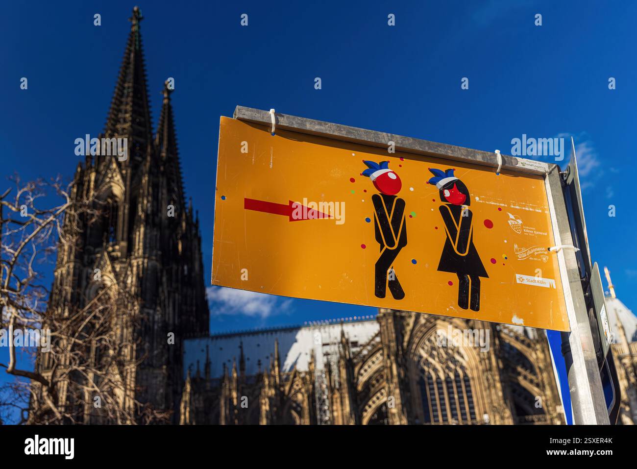 COLOGNE, GERMANY - FEBRUARY 23, 2025: A sign indicating public toilets ...