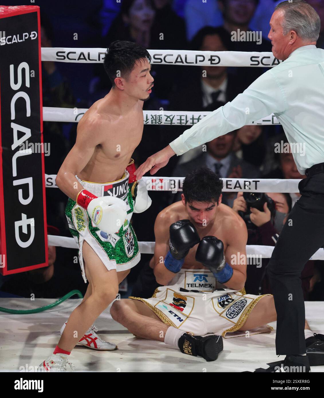Junto Nakatani of Japan (green) takes down in the 3rd round of WBC ...