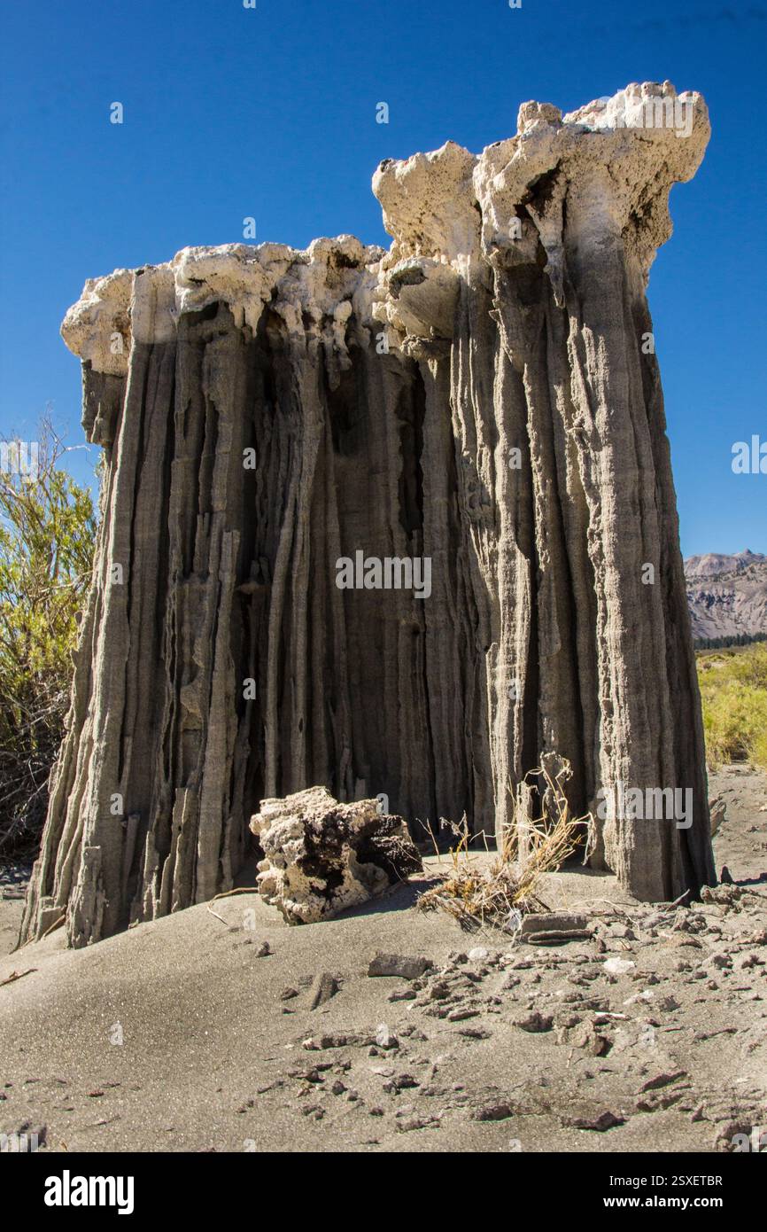 Large rock with a small rock on top of it. The rock is surrounded by ...