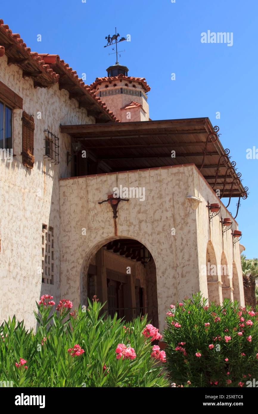 Building with a white roof and a red roof. The roof has a weather vane ...
