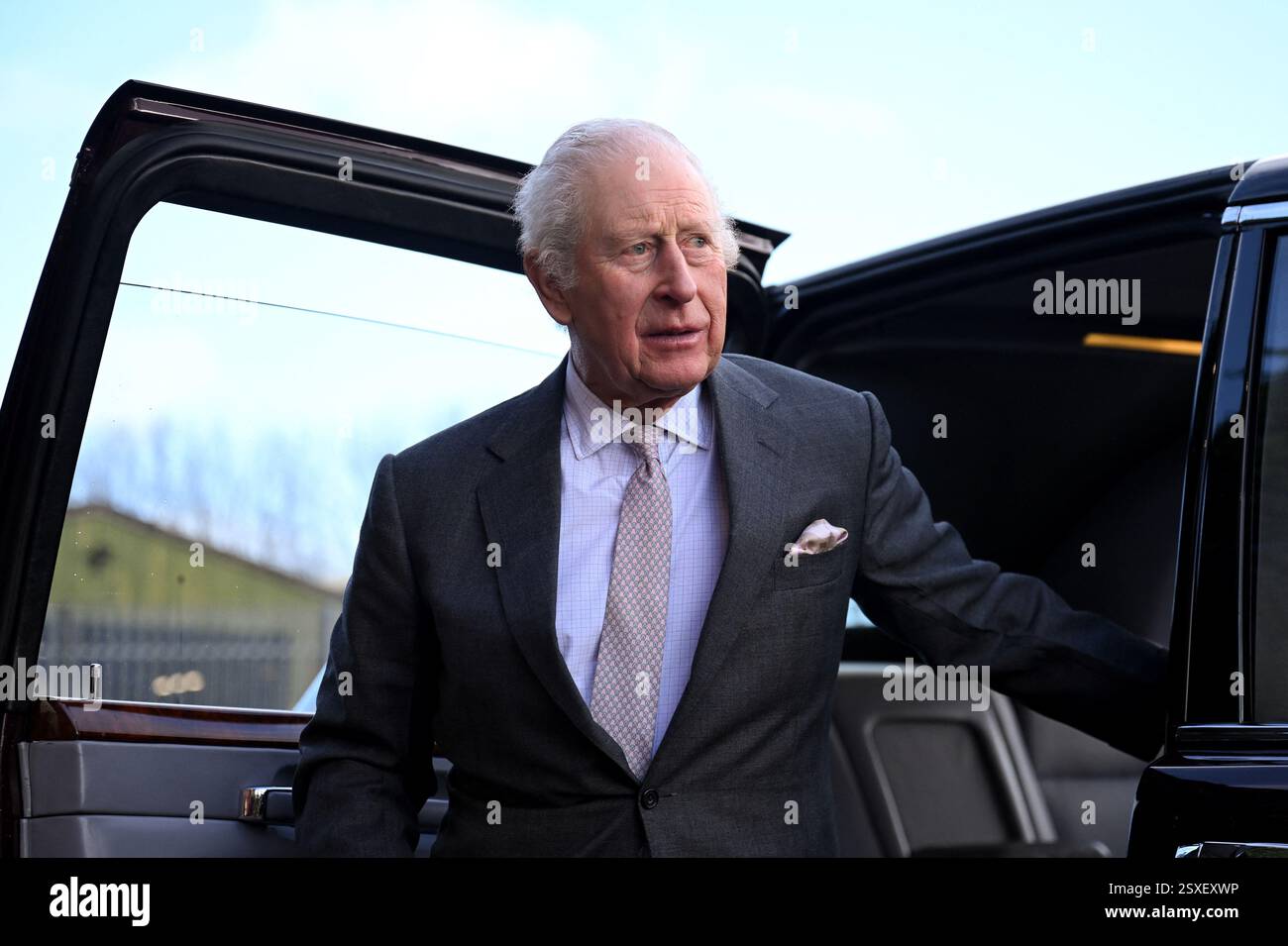 King Charles III steps out of a vehicle during a visit to Tower Brewery ...