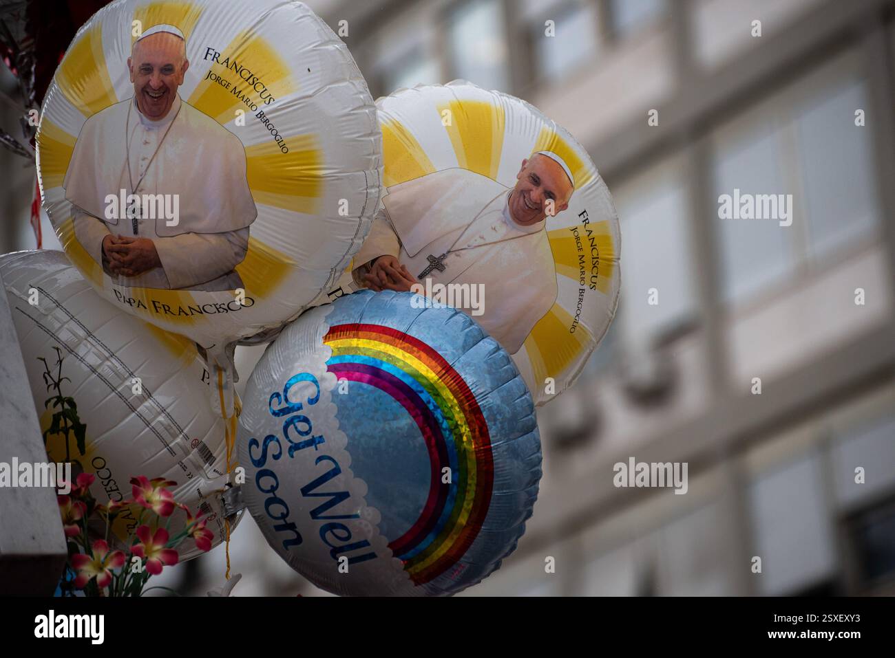 Rome, Italy. 24th Feb, 2025. Balloons have been left by faithful under ...