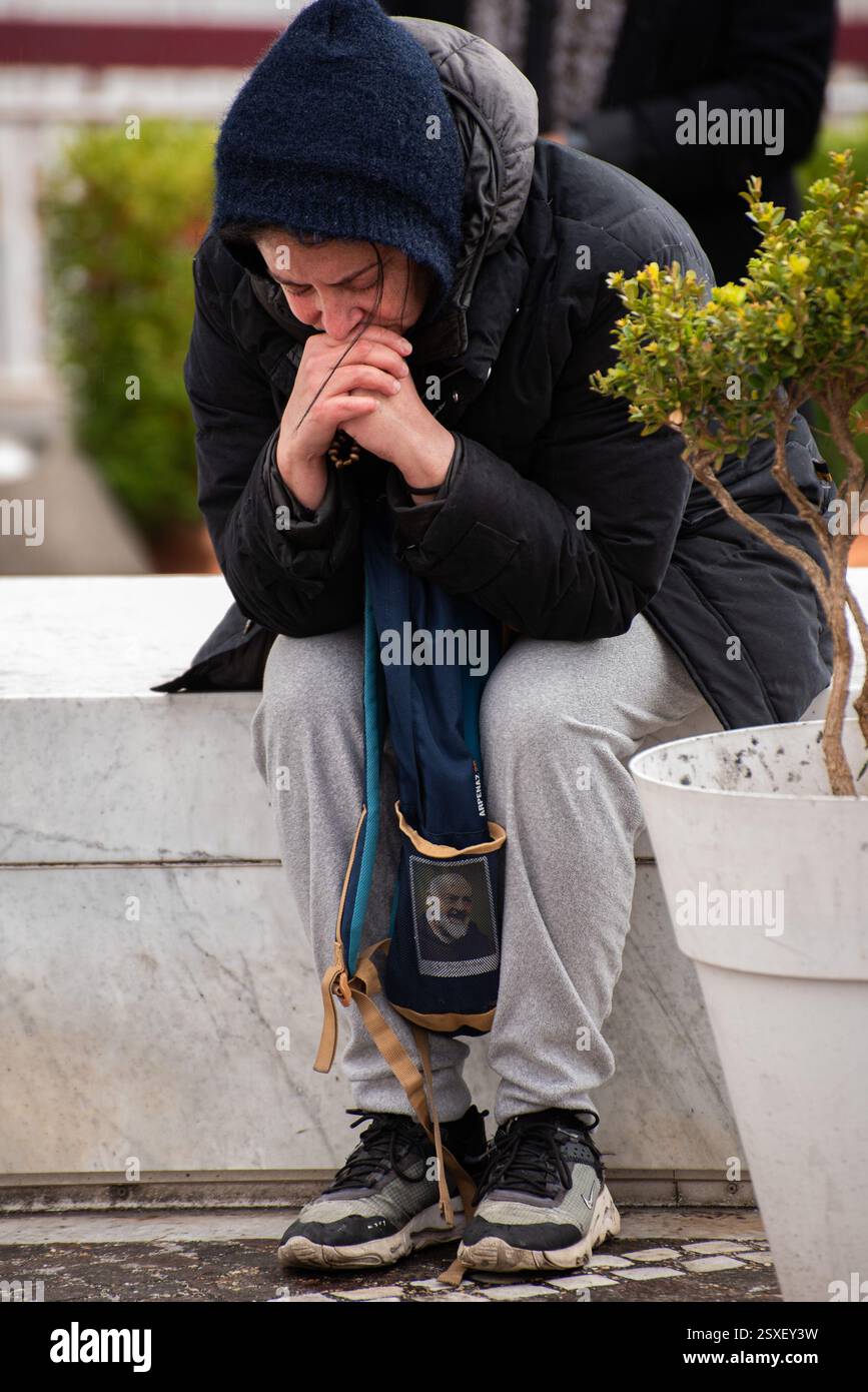 Rome, Italy. 24th Feb, 2025. Faithful pray in front of the statue of ...
