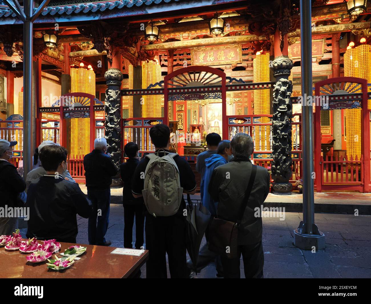 Image of people praying in the Longshan Temple Stock Photo - Alamy