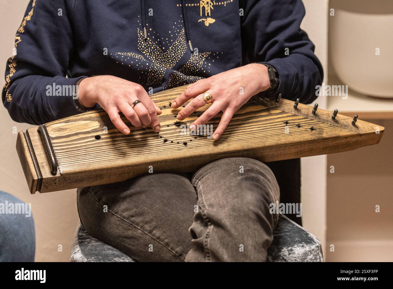 Fingers of a girl playing kankles, Lithuanian plucked string instrument ...