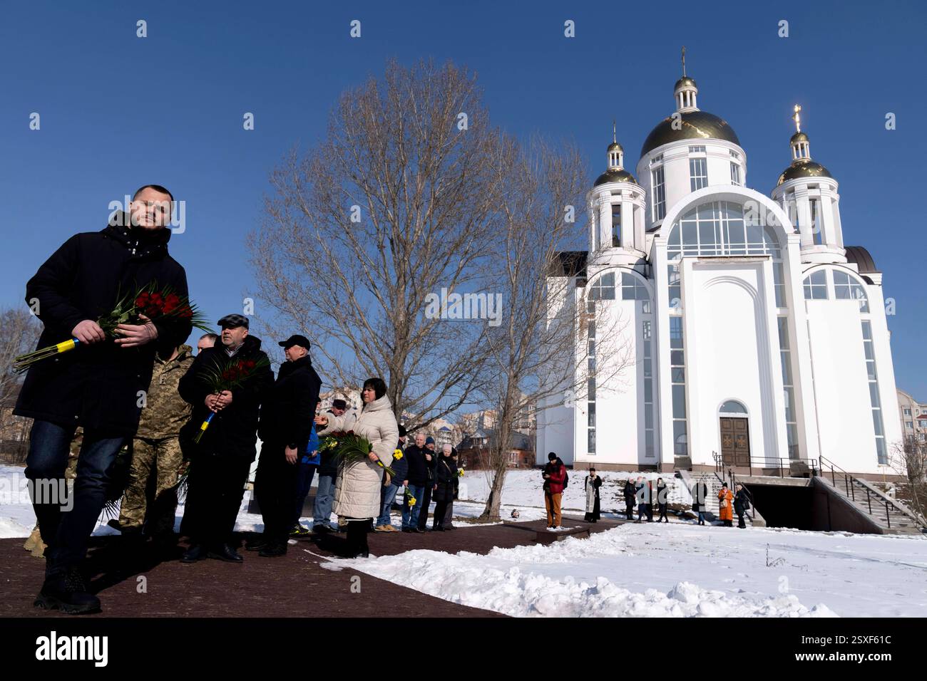 Ceremony honoring killed civilians at the site of a mass grave in Bucha ...