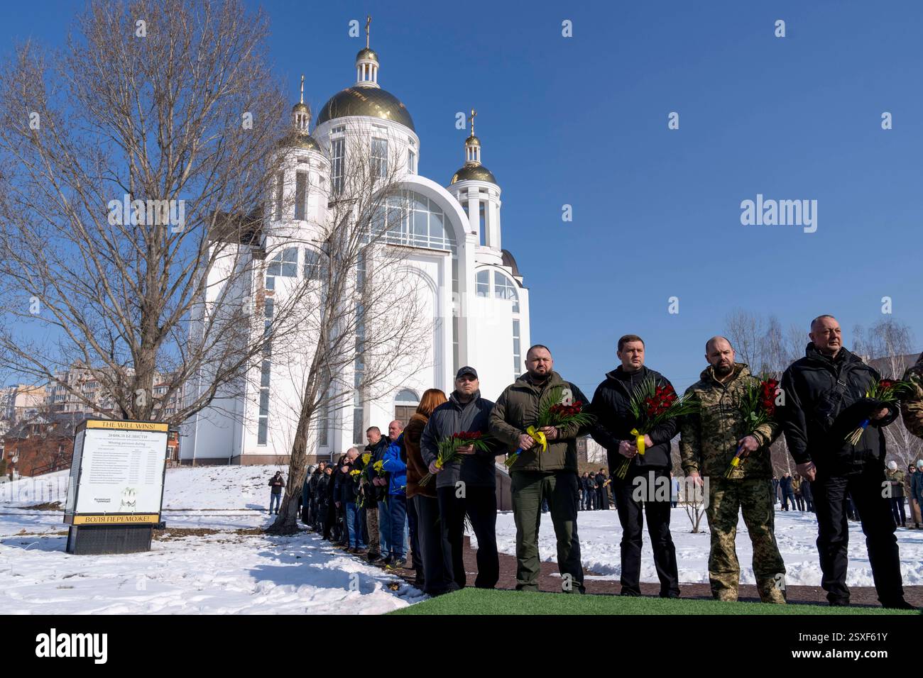Ceremony honoring killed civilians at the site of a mass grave in Bucha ...