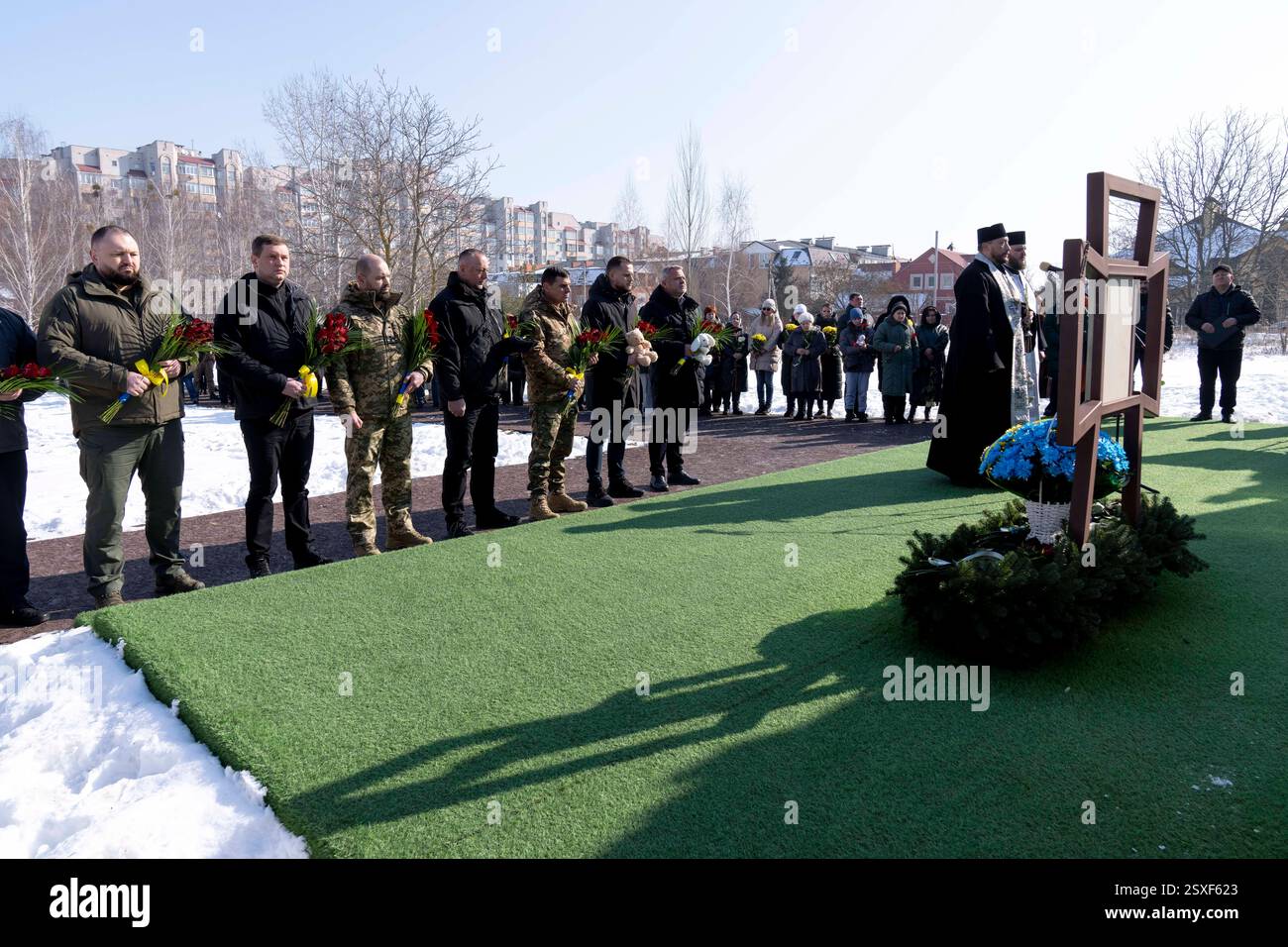 Ceremony honoring killed civilians at the site of a mass grave in Bucha ...