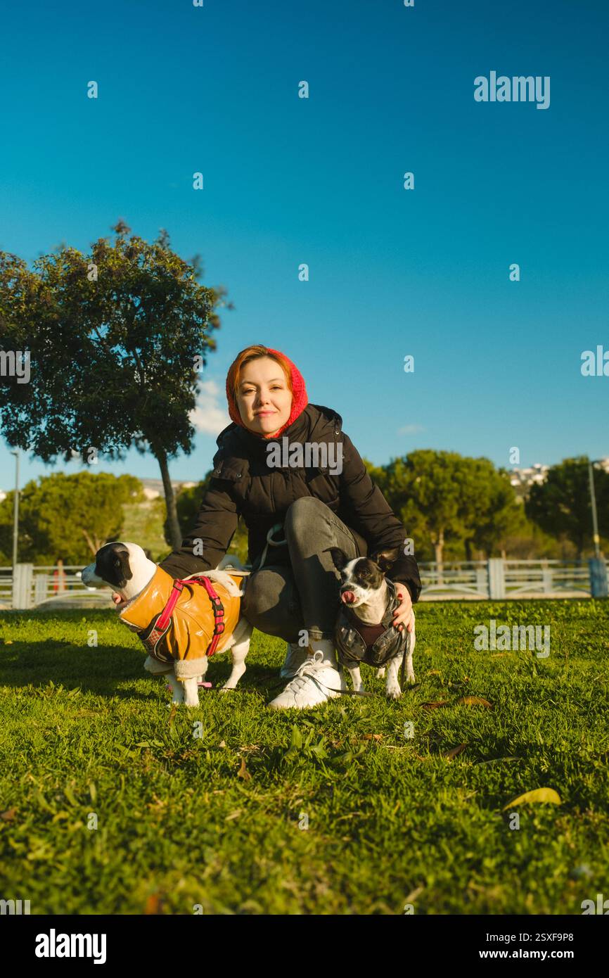 Woman strolls through park enjoying hi-res stock photography and images ...