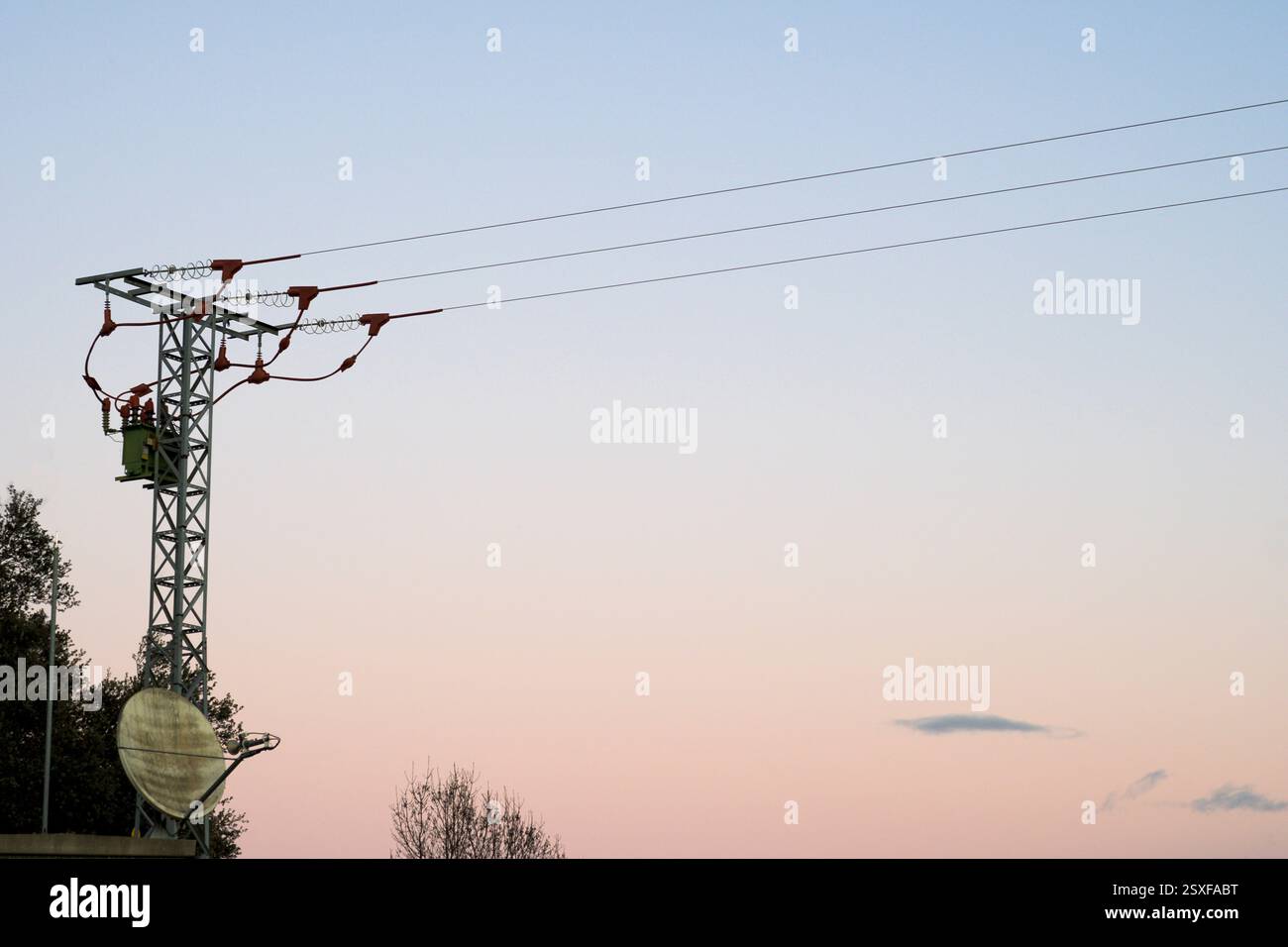 Small electric tower in hydroelectric power station with light ...