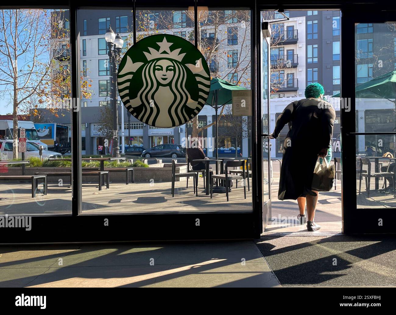 FILE - A customer exits a Starbucks store in Oakland, Calif., Jan. 16 ...