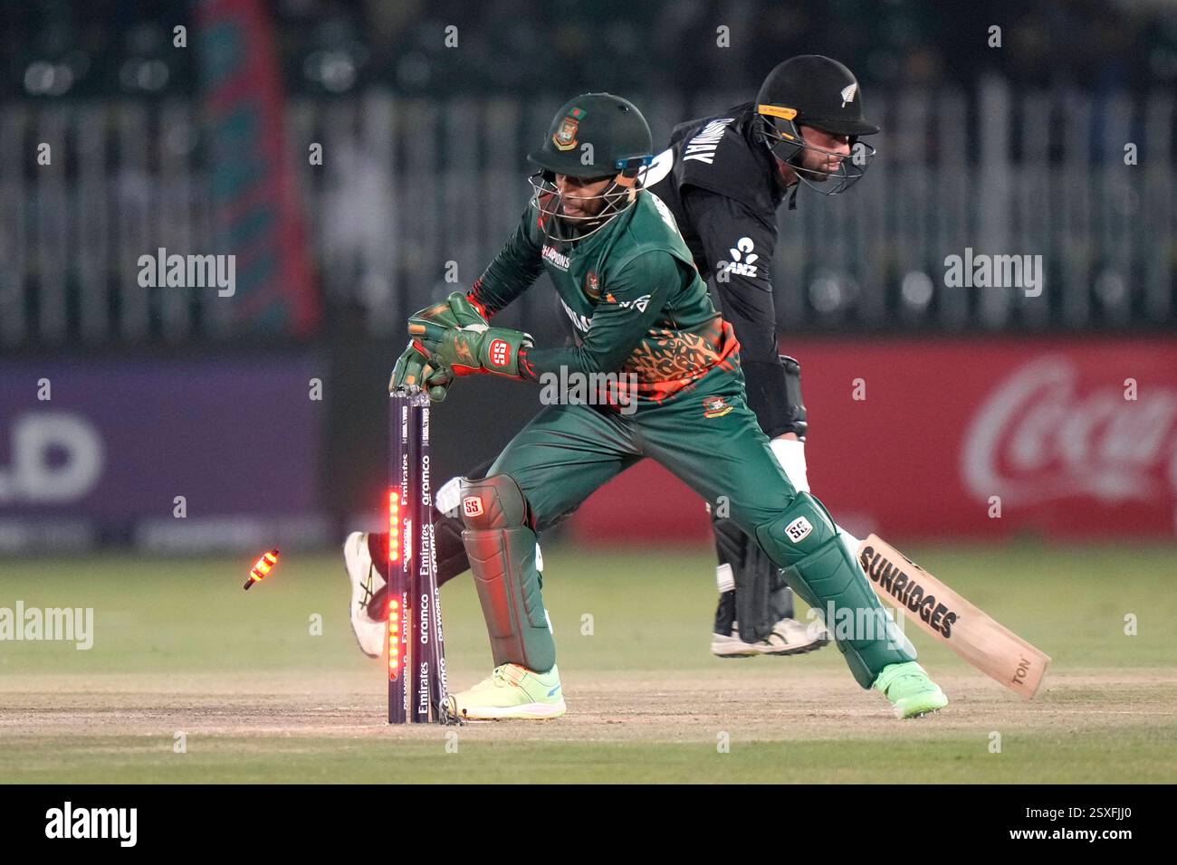 Bangladesh's Mushfiqur Rahim, front, attempts to run out to New Zealand ...