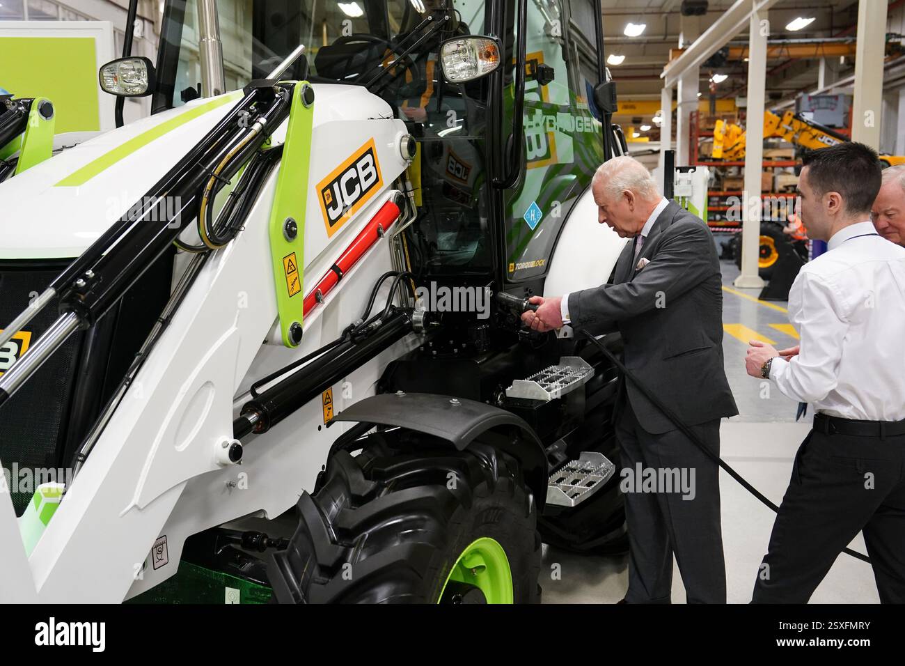 King Charles III is shown how to refuel JCB's recently-developed ...