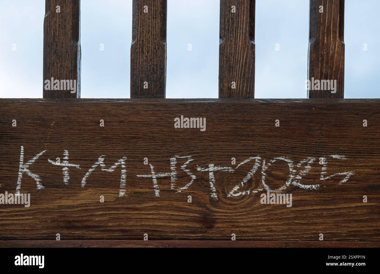 Sign written on the fence K+M+B+2025 from latin language Christus ...