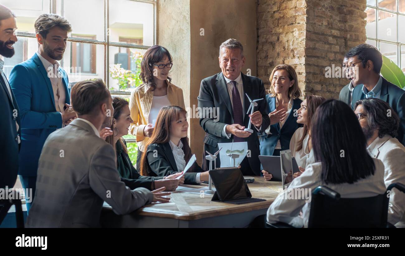 A diverse corporate team celebrating an achievement at an office award ceremony. A senior ...