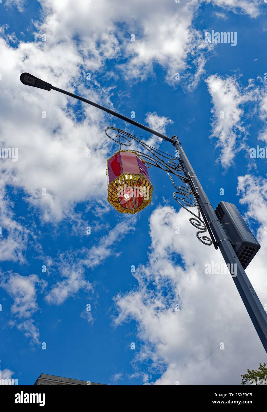 Chinese red lantern attached to street light pole at corner of Worth ...