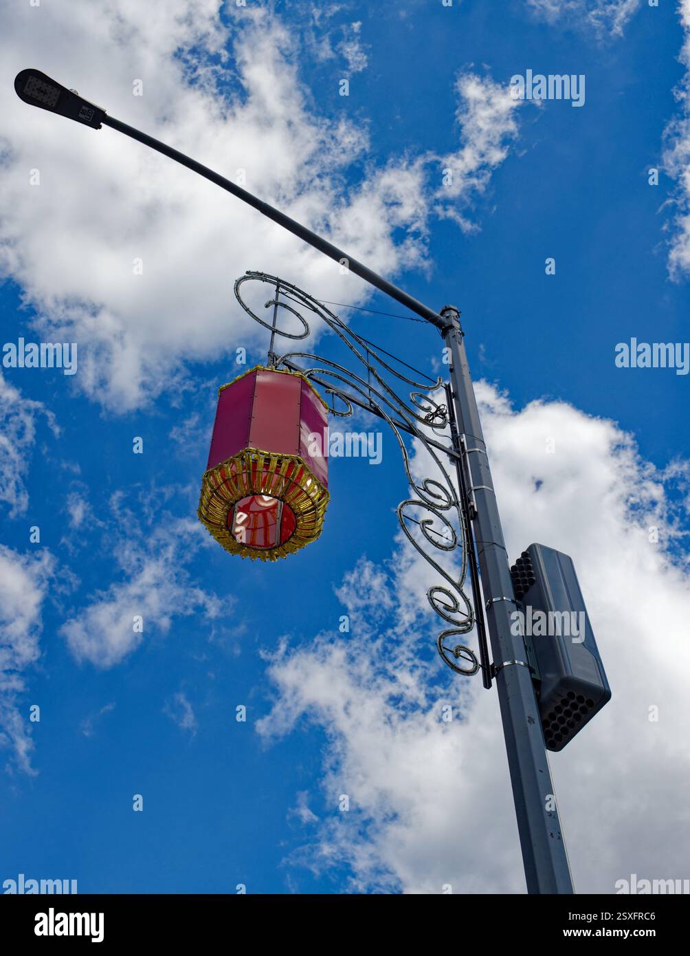 Chinese red lantern attached to street light pole at corner of Worth ...