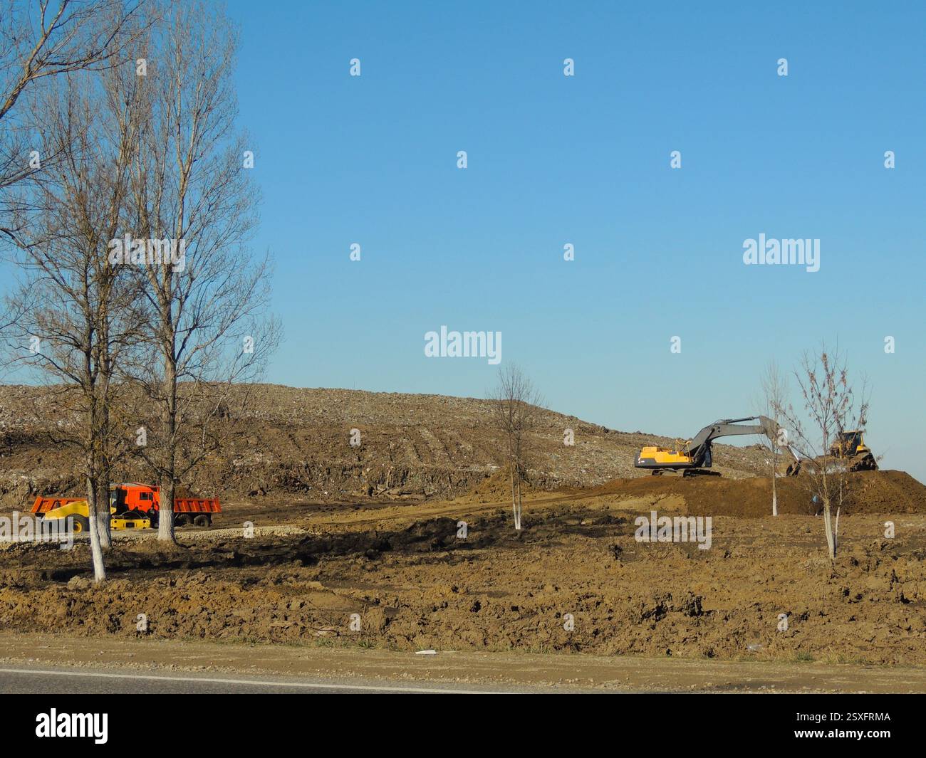 Excavator machine leveling hill soil hi-res stock photography and ...