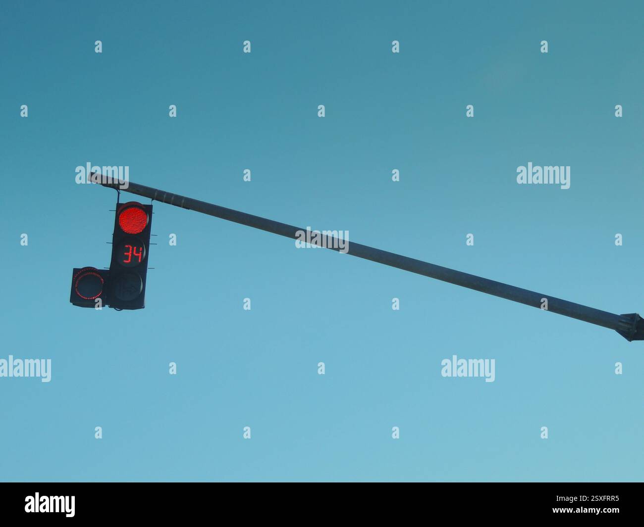 road overhead traffic light with red signal light and number 34 ...