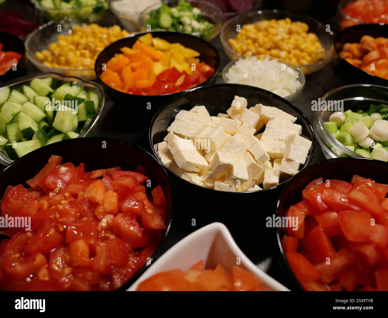 Fresh, colorful vegetable bowls with tomatoes, cucumbers, peppers, corn ...