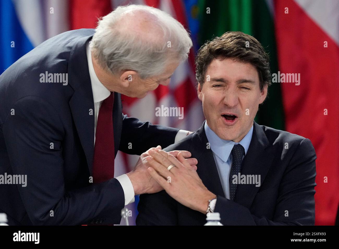 Canadian Prime Minister Justin Trudeau (right) shares a laugh with ...