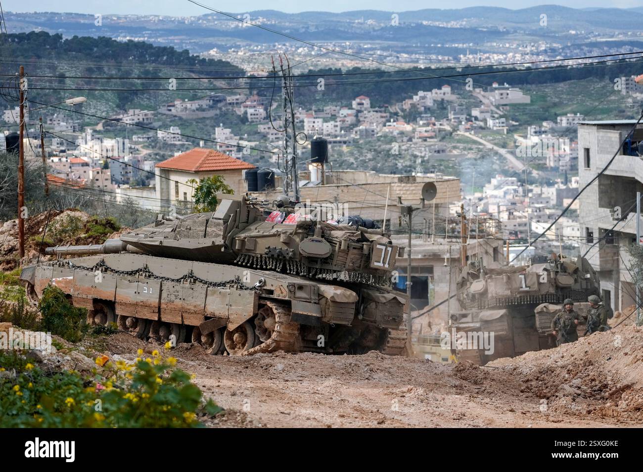 Israeli tanks are deployed during an ongoing army operation in the West ...
