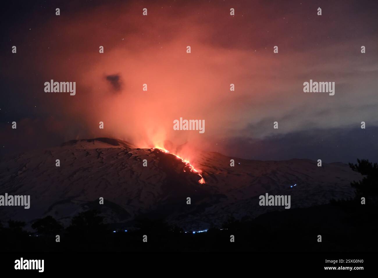 The image captures a dramatic scene of Mount Etna in Sicily, an active ...