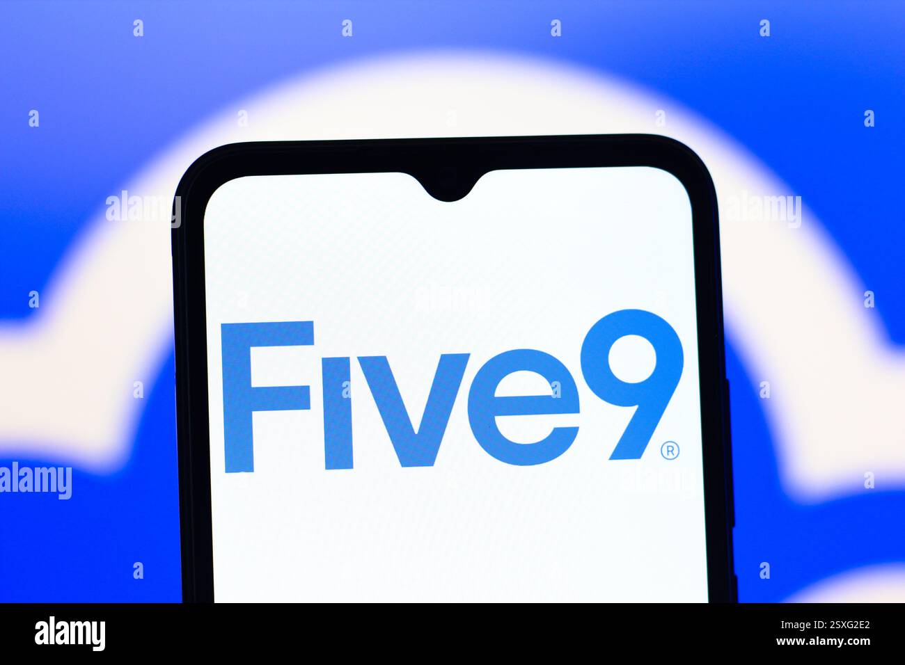 In this photo illustration, the Five9 logo is seen displayed on a ...