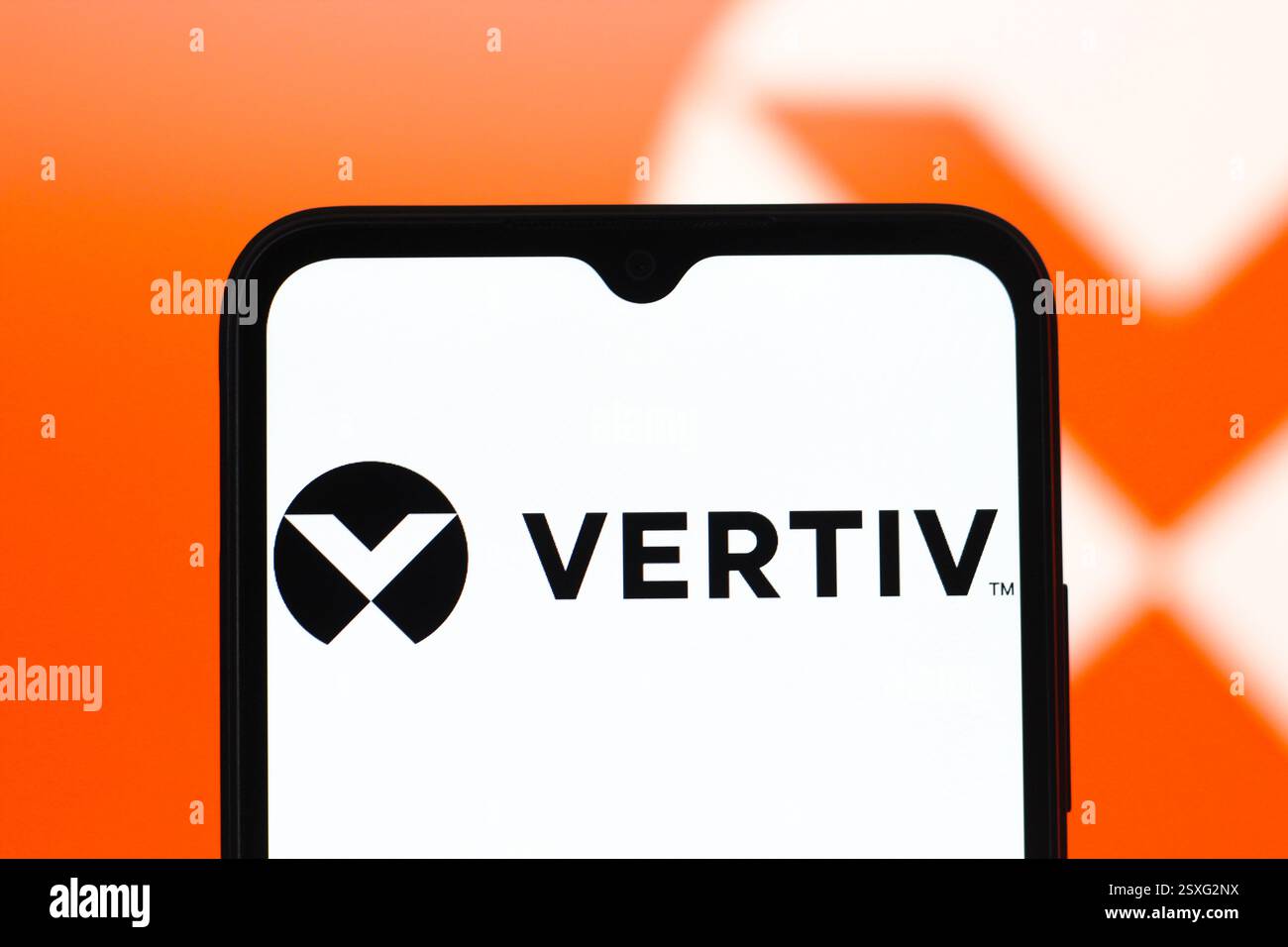 In this photo illustration, the Vertiv logo is seen displayed on a ...
