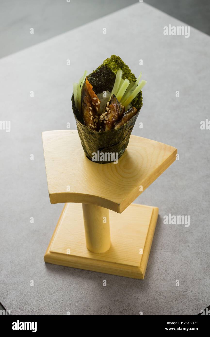 Sushi eel rolls hand hi-res stock photography and images - Alamy