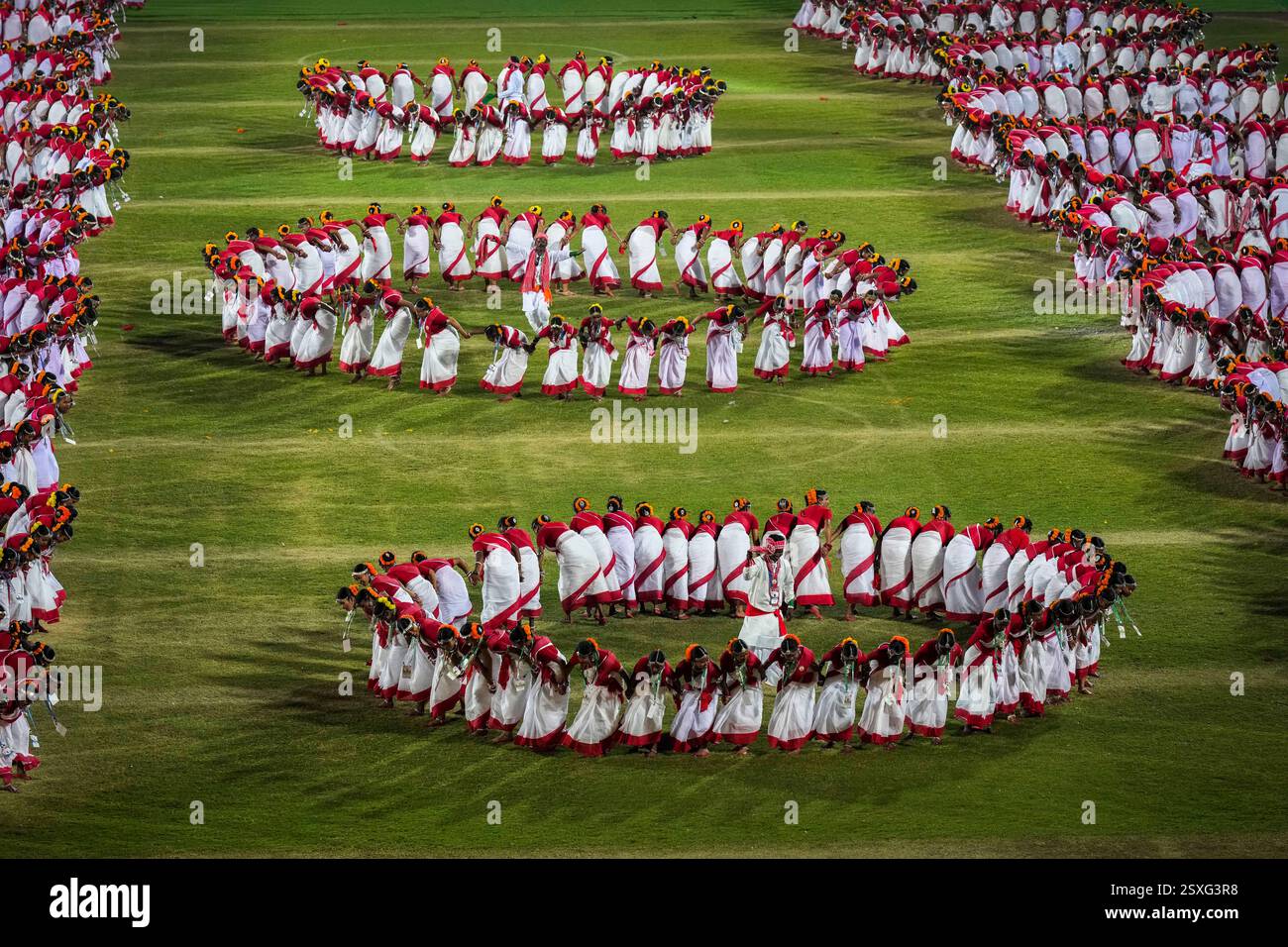 Tribal youth perform Jhumur dance during a dance event attempting a ...