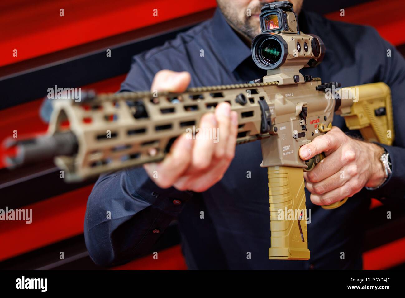 Nuremberg, Germany. 24th Feb, 2025. A man holds the G95 KA1 assault ...