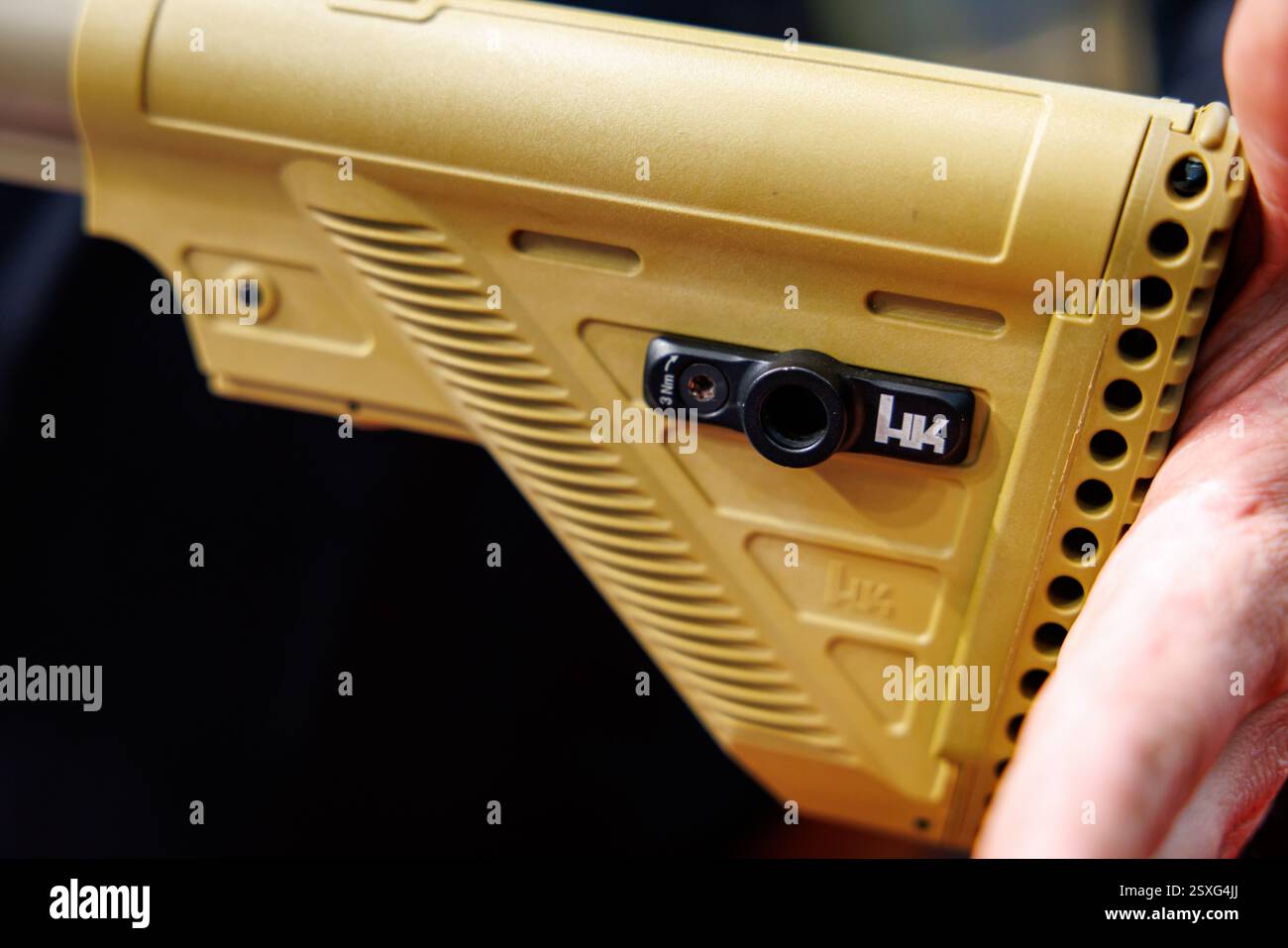 Nuremberg, Germany. 24th Feb, 2025. A man holds the G95 KA1 assault ...
