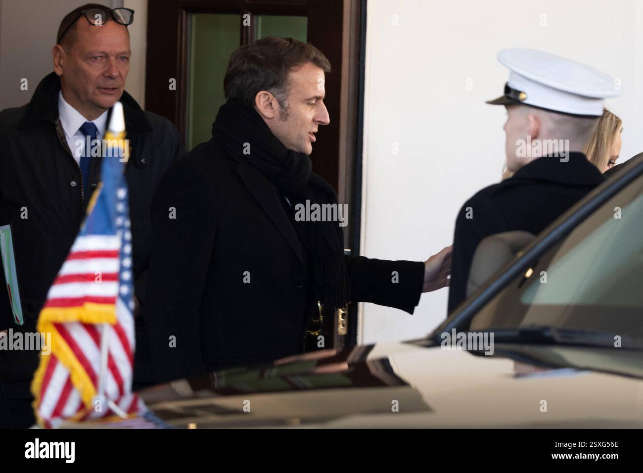 France's President Emmanuel Macron leaves the White House, Monday, Feb ...