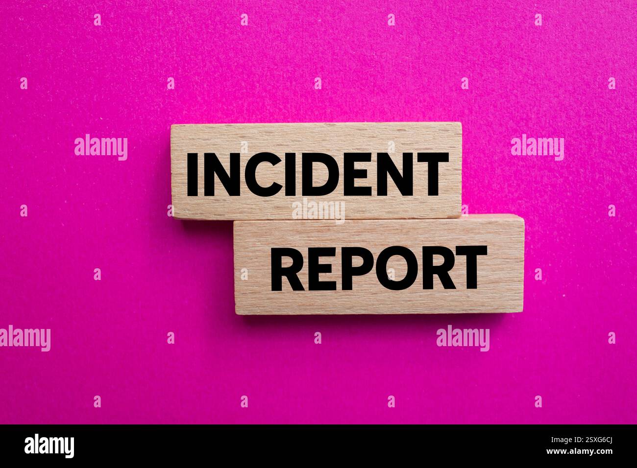 Incident report message written on wooden blocks on pink background ...
